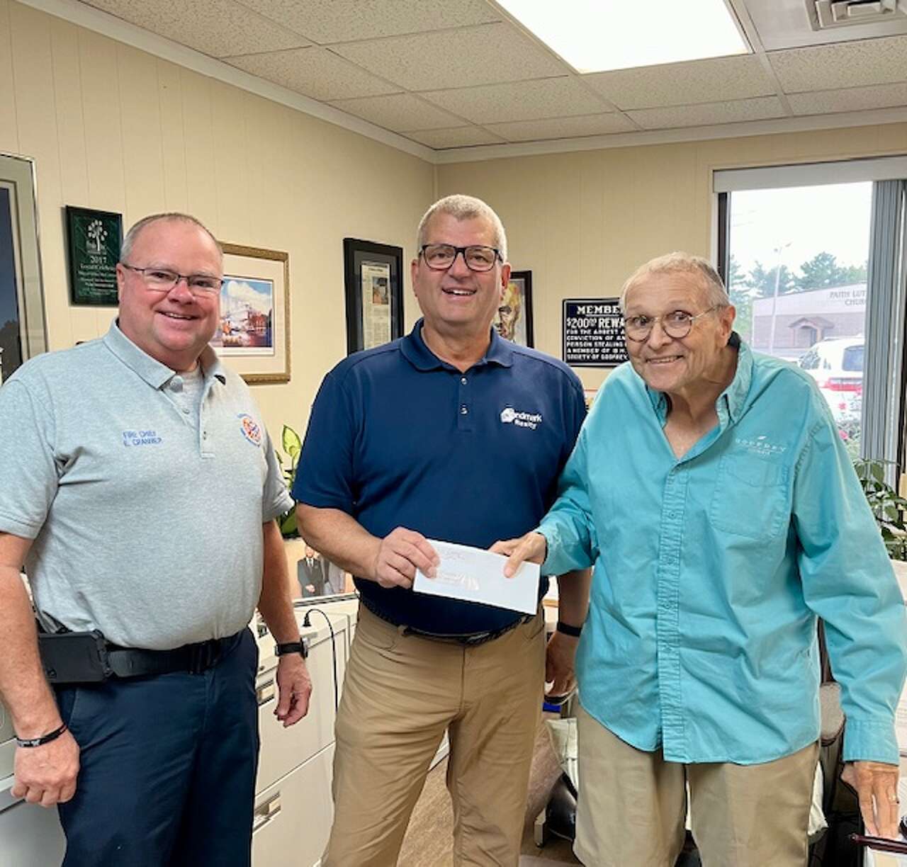 Godfrey Mayor presents $50K check to Fire Protection District