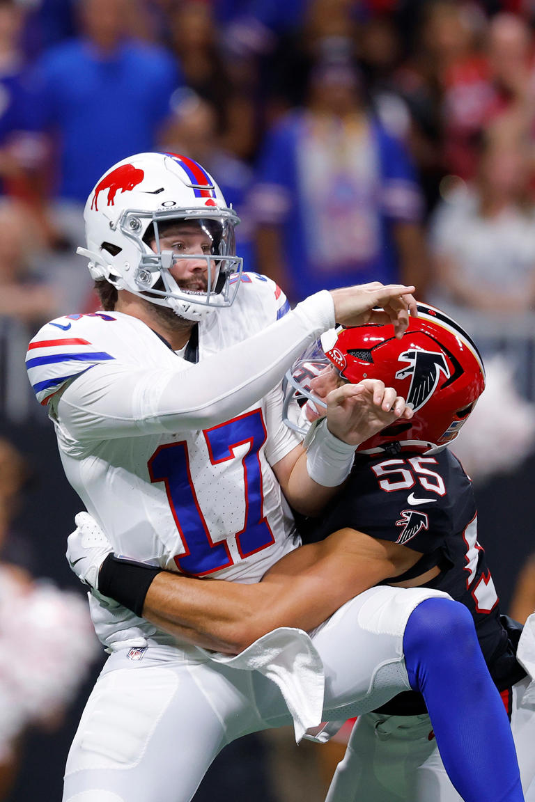 Josh Allen injury: Bills QB holds previously broken hand in pain after ...