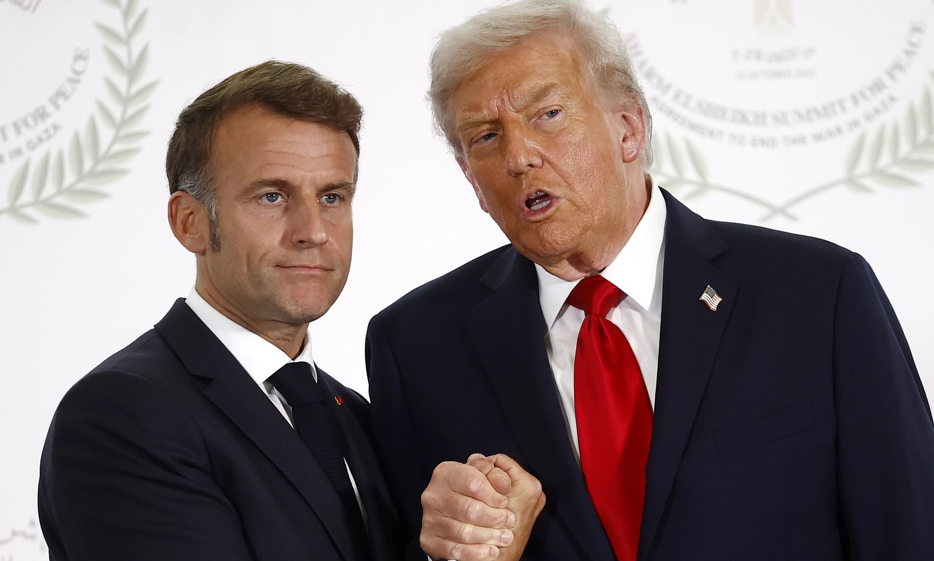 Trump and Macron continue ongoing handshake contest with bizarre 'arm ...