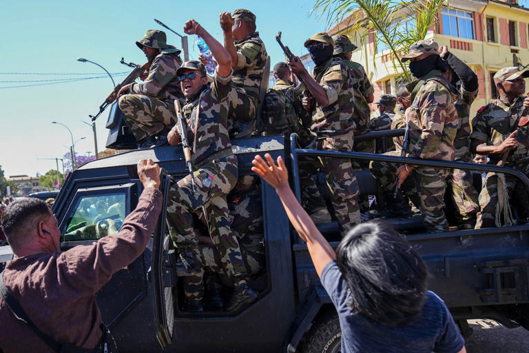 Madagascar's president flees after soldiers turned against him ...