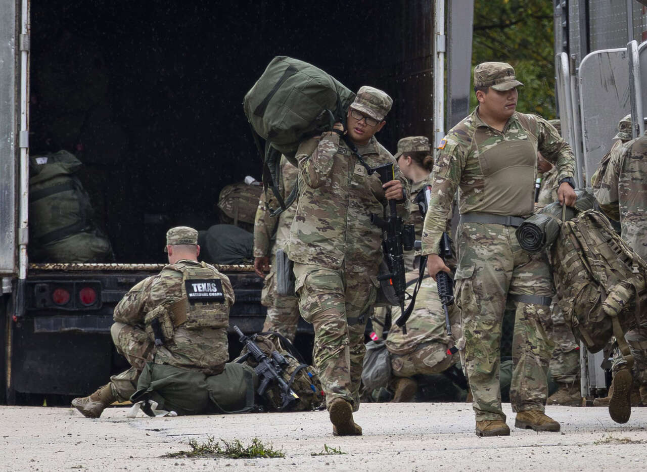 Some Texas troops return amid online ridicule over appearance