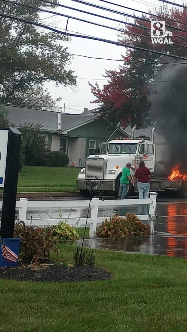 Tractor-trailer hauling corn goes up in flames