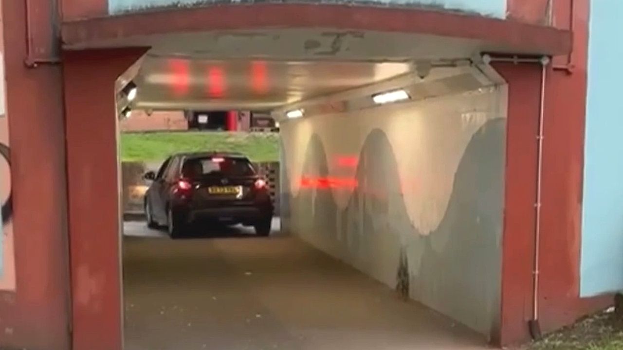 Dozy driver wedges car in underpass after 'getting lost' in UK town