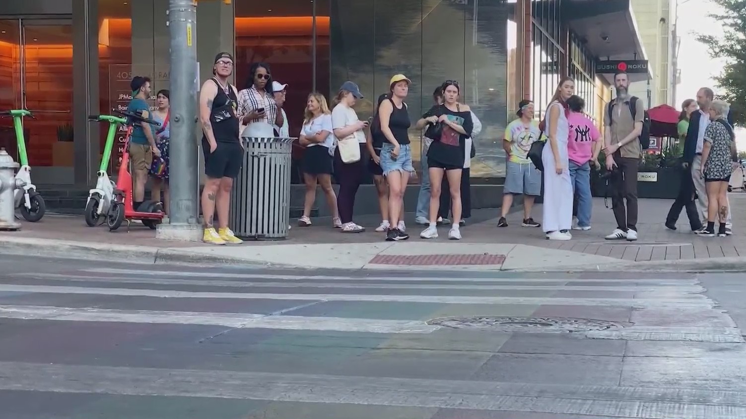 People gather at rainbow crosswalk in downtown Austin
