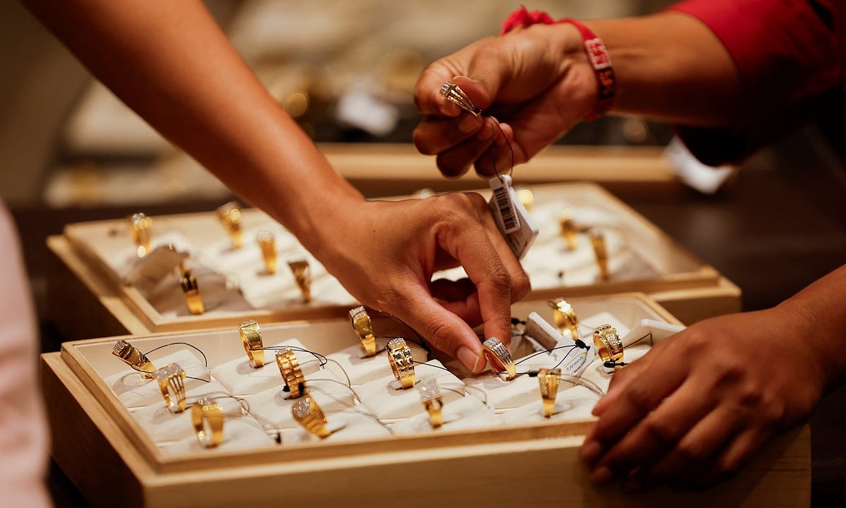 Gold breaks $4,100 to hit high on trade jitters, rate-cut optimism