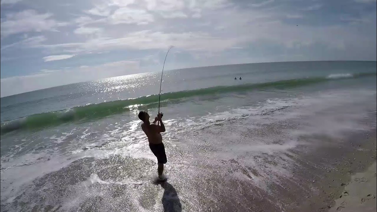 The ultimate beach fishing battle with giant fish on the line
