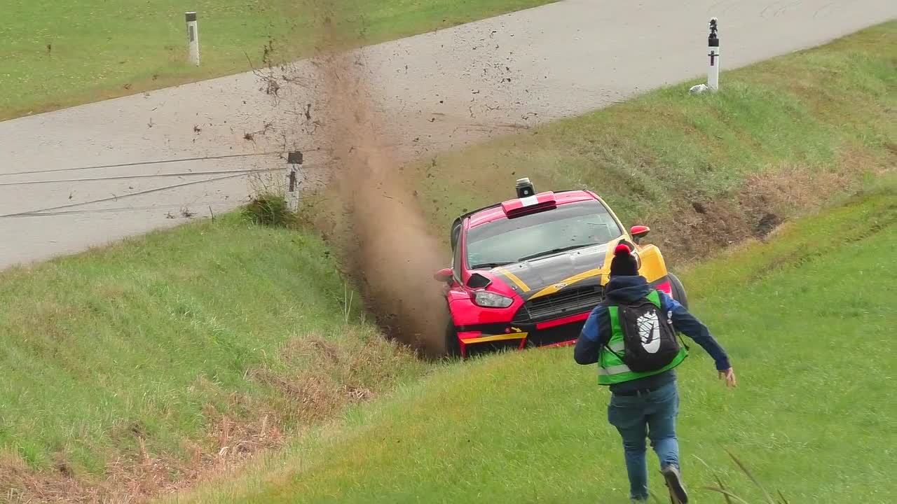 Rally car crashes into ditch before almost hitting spectator running to ...