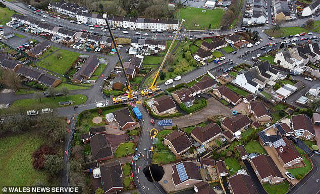 Giant 50ft-deep crater that swallowed up Love Island winner's driveway ...