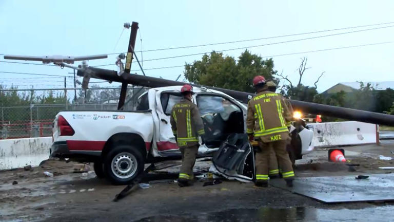 Woman trapped after truck hits power pole in Fresno County