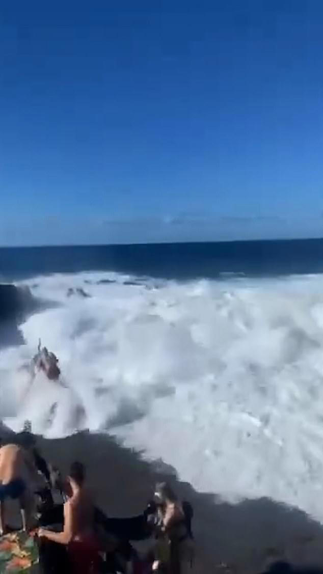 Moment giant wave wipes out tourists on Tenerife as Brits scream