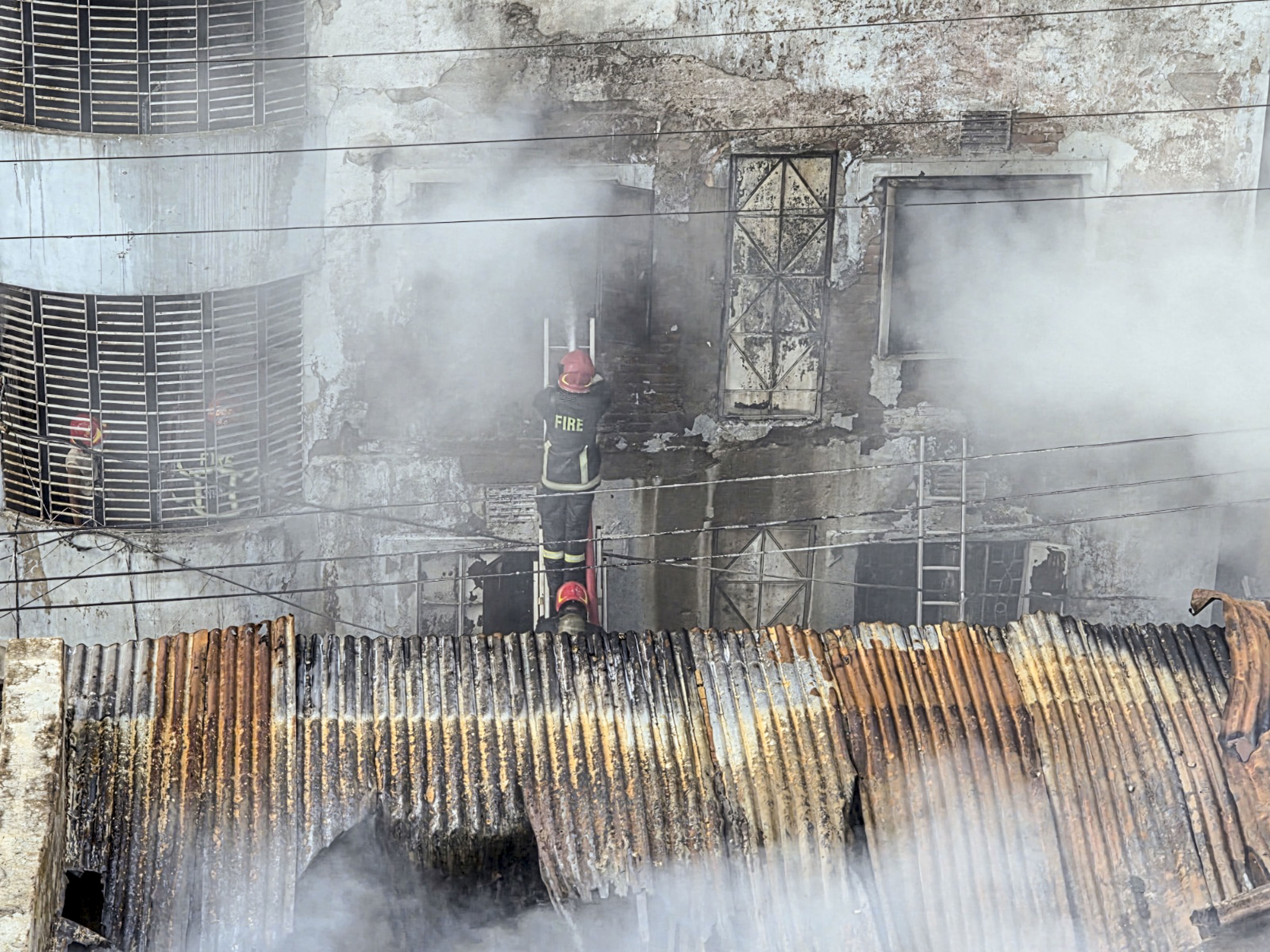 16 killed in fire at garment factory and chemical warehouse in Bangladesh