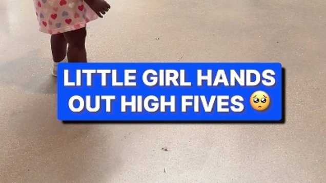 Adorable toddler hands out high fives