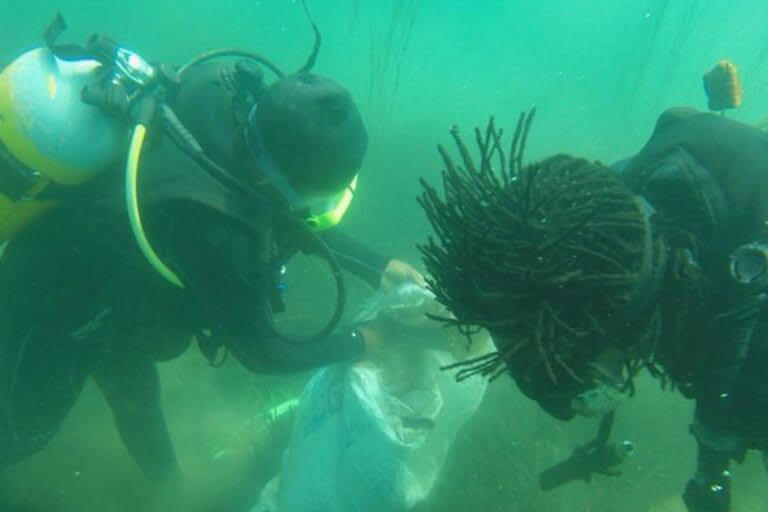 Local divers pick away at Lake Malawi’s underwater garbage problem