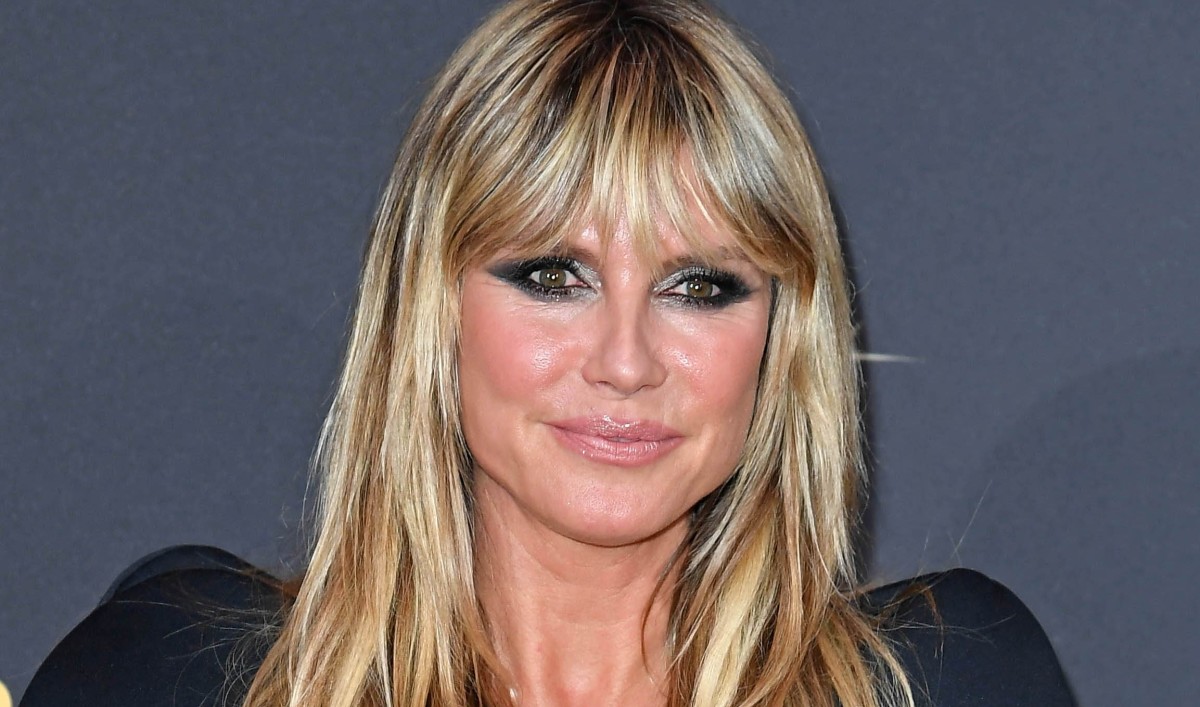 Heidi Klum Serves Looks in Plunging Black Dress While Making a ...