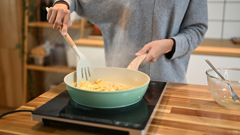 Start Scrambling Your Eggs In Bacon Grease And You'll Never Turn Back