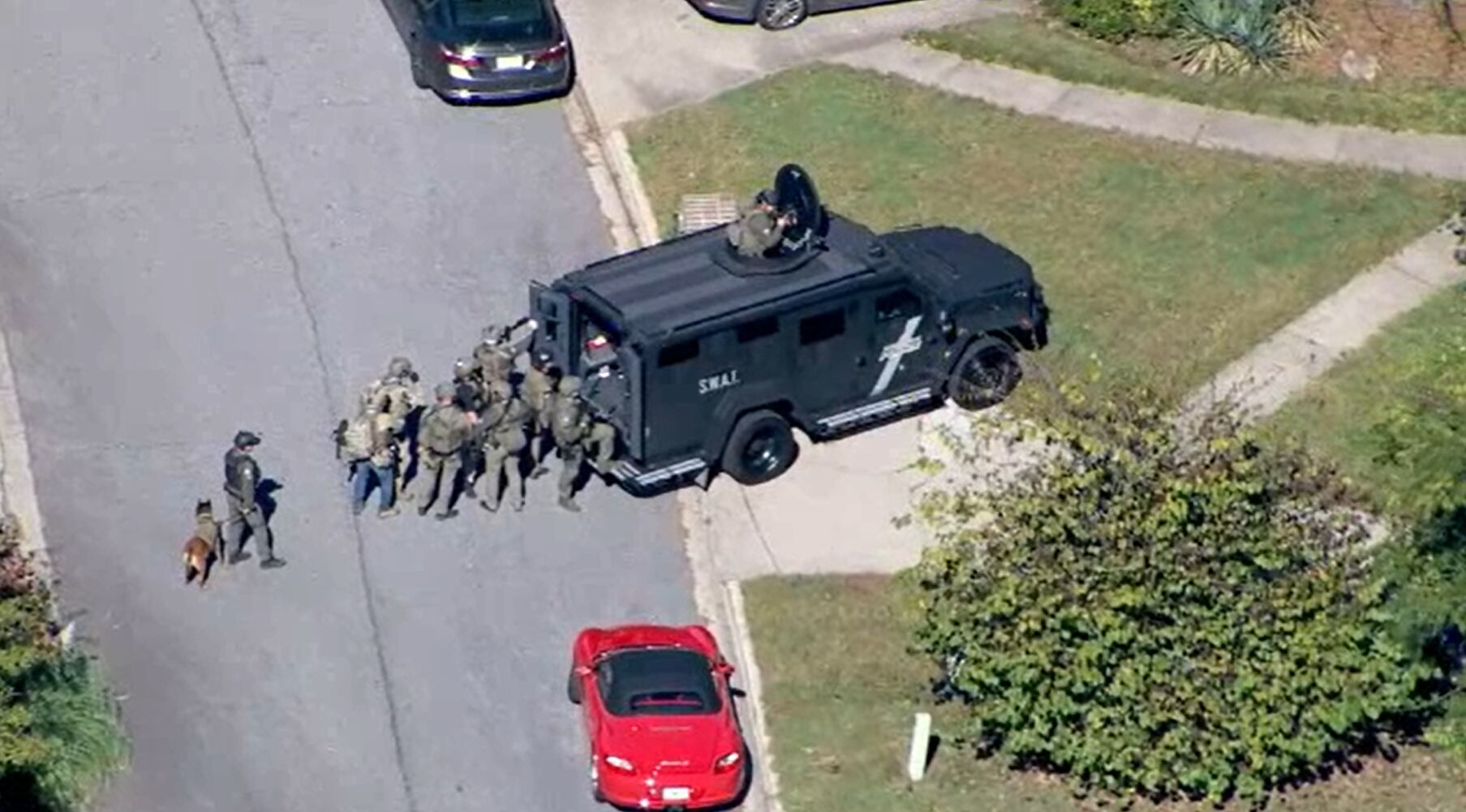 Officer shot in Ga. SWAT standoff; suspect surrenders, police say
