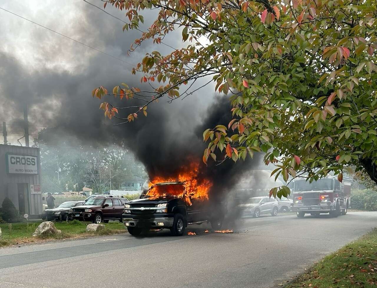 Branford firefighters try to extinguish car fire near Elm Street