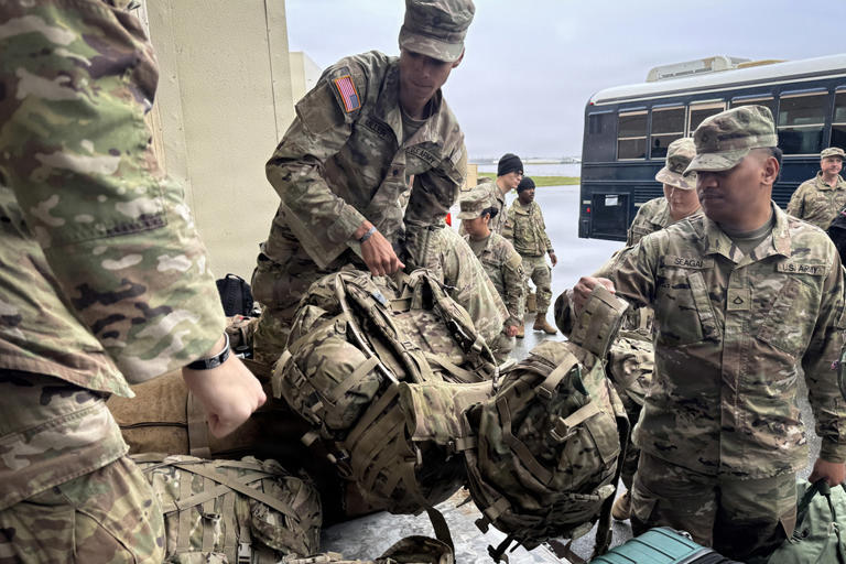 Officials airlift evacuees to safety after the remnants of Typhoon ...