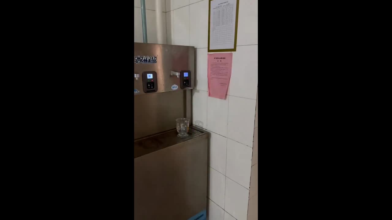 Automatic hot water dispenser causes funny spill in Shanxi, China