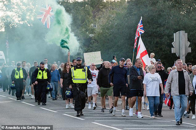 Charges dropped against woman who waved Union flag from council HQ in ...