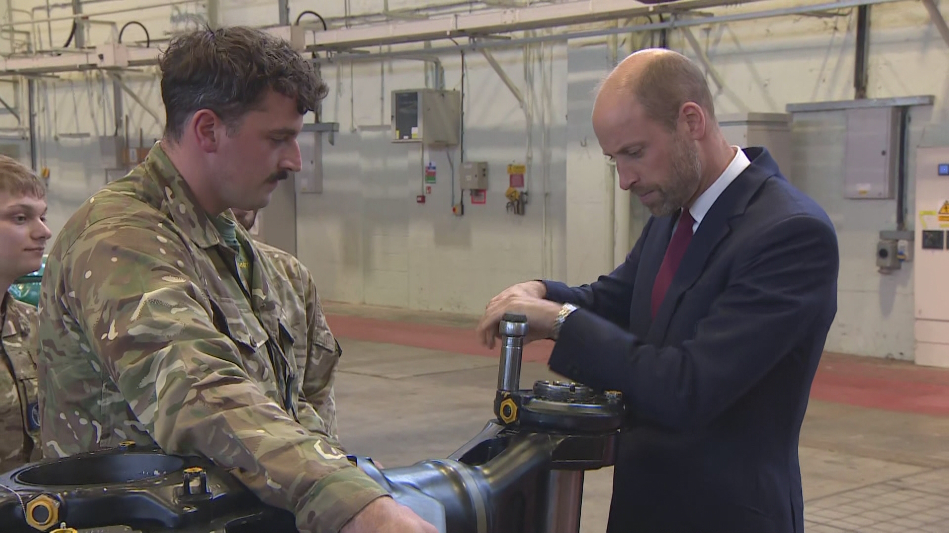 Prince of Wales works on rotor head during RAF visit
