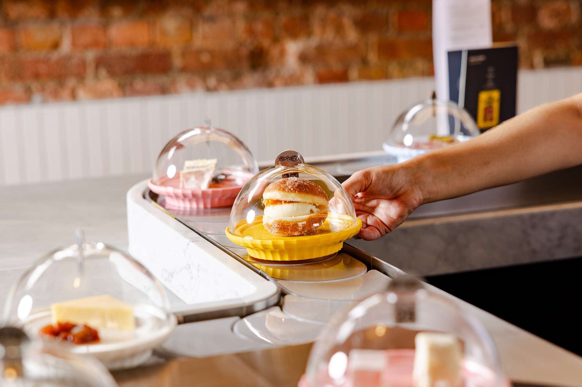 London’s Famous Cheese Conveyor Belt Restaurant Is Coming to New York ...