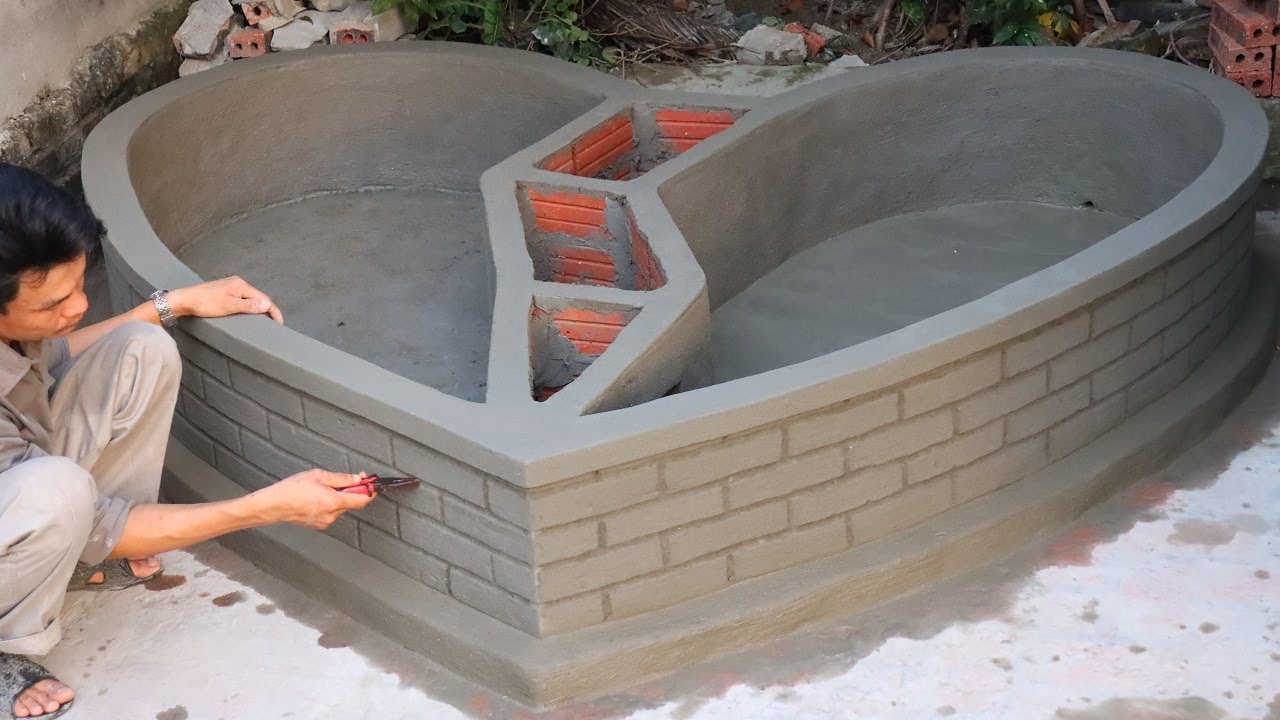 Creative garden design: Heart-shaped aquarium with cement & brick