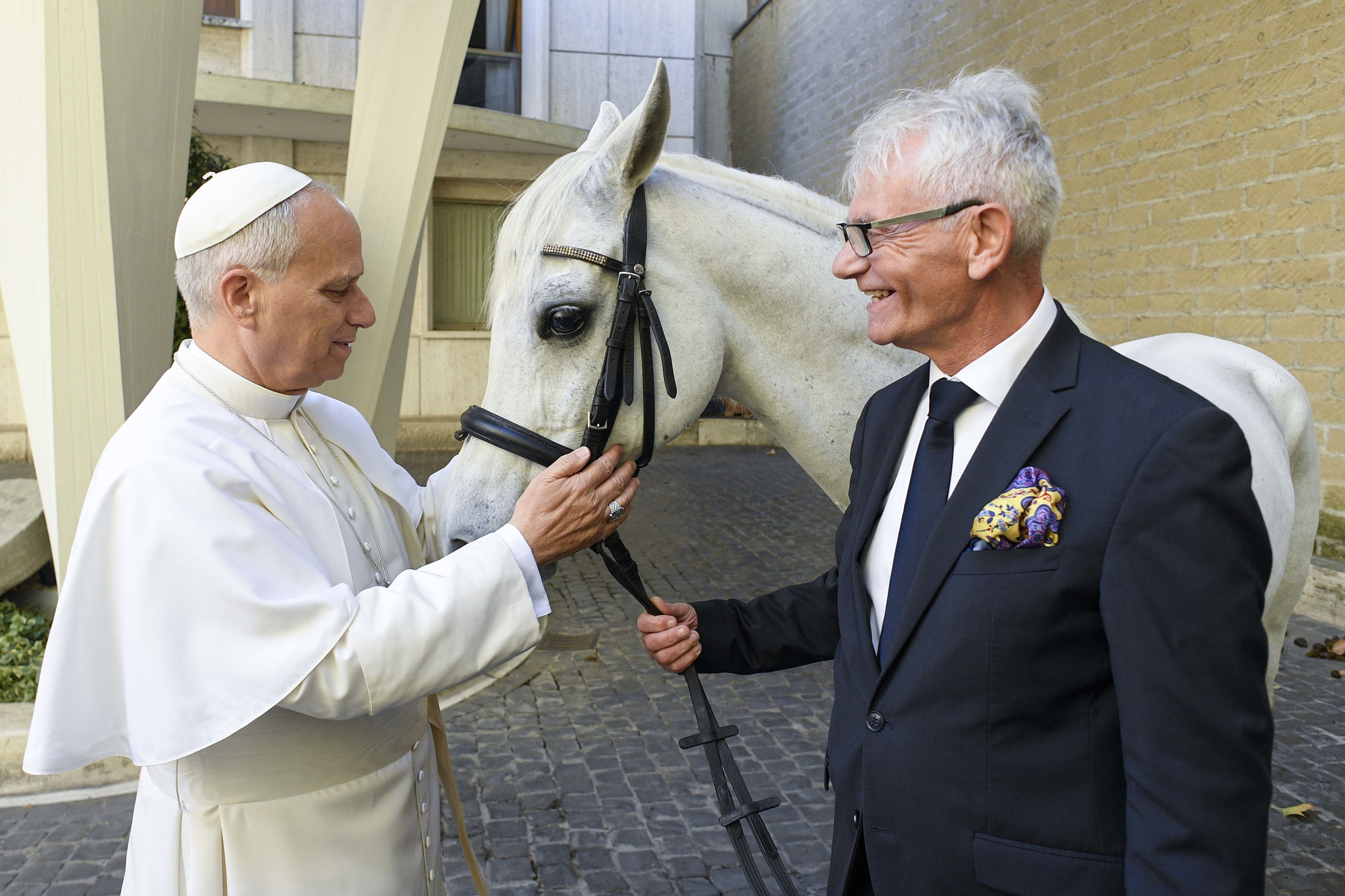 Pope receives gift of white horse