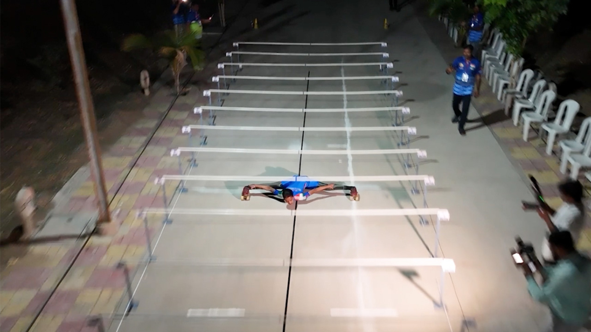 Fastest time to limbo skate under descending poles over 50m - 7.46 ...