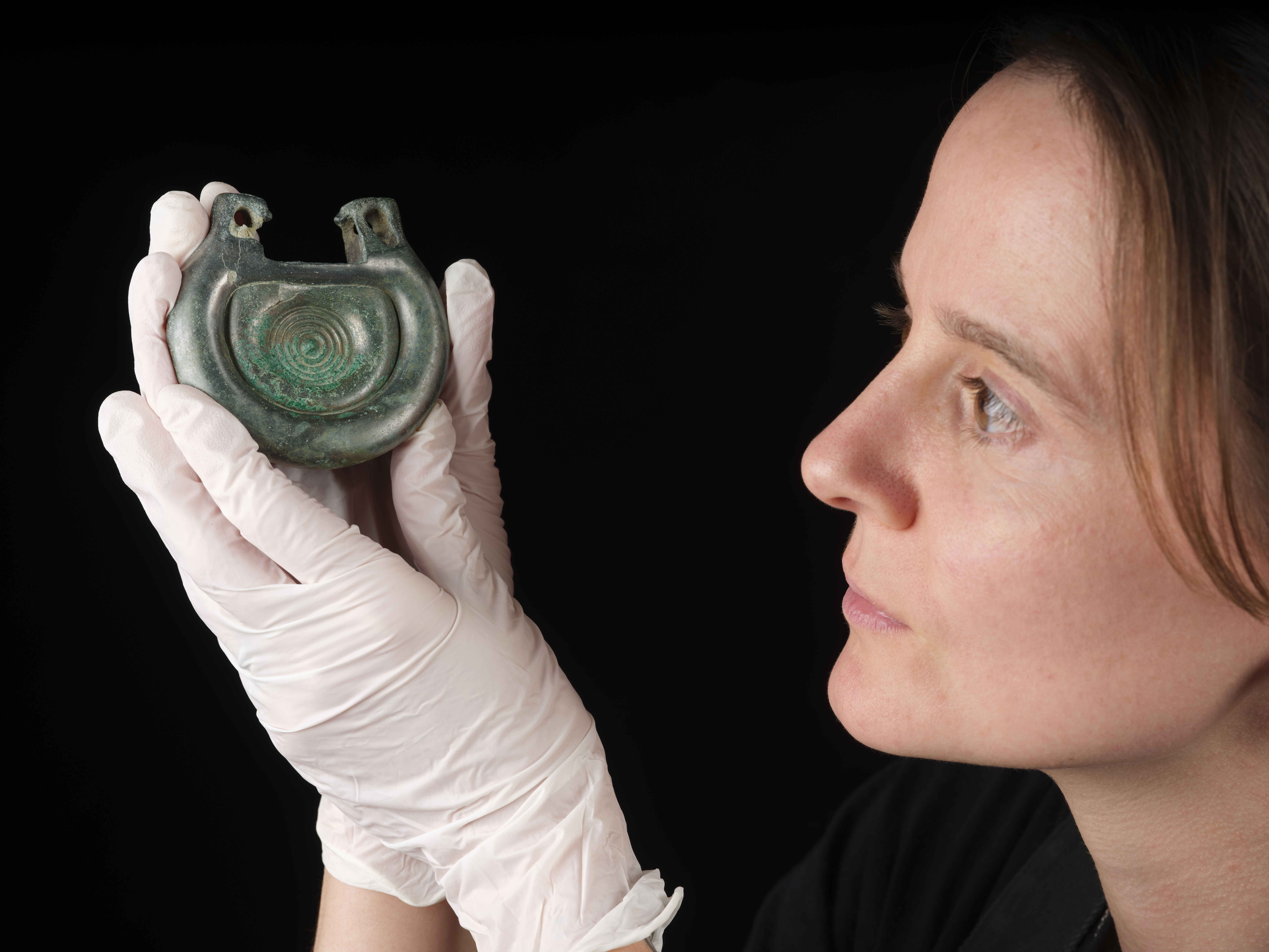 Museum staff describe ‘magical’ moment hoard’s silver colour was revealed