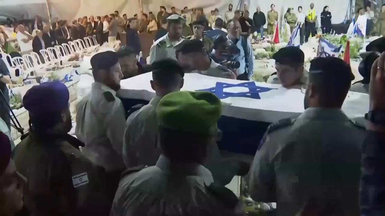 Released hostage and president attend funeral of Israeli soldier whose ...
