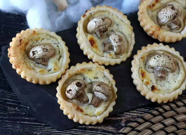 Halloween tarts with mushrooms and garlic-herb cheese