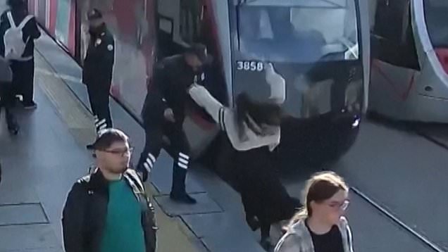 Quick-thinking guard saves woman split second before she's hit by tram