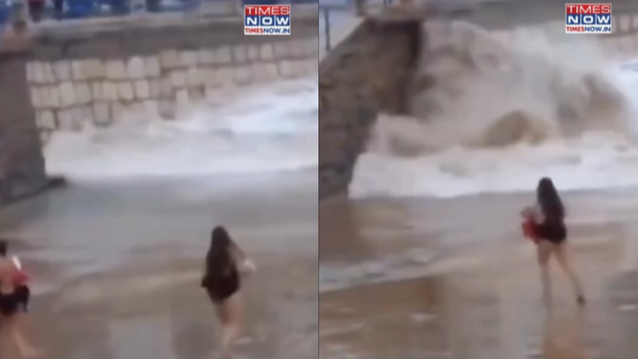 Dismissing Massive Incoming Wave, Woman Continues To Play At Beach ...