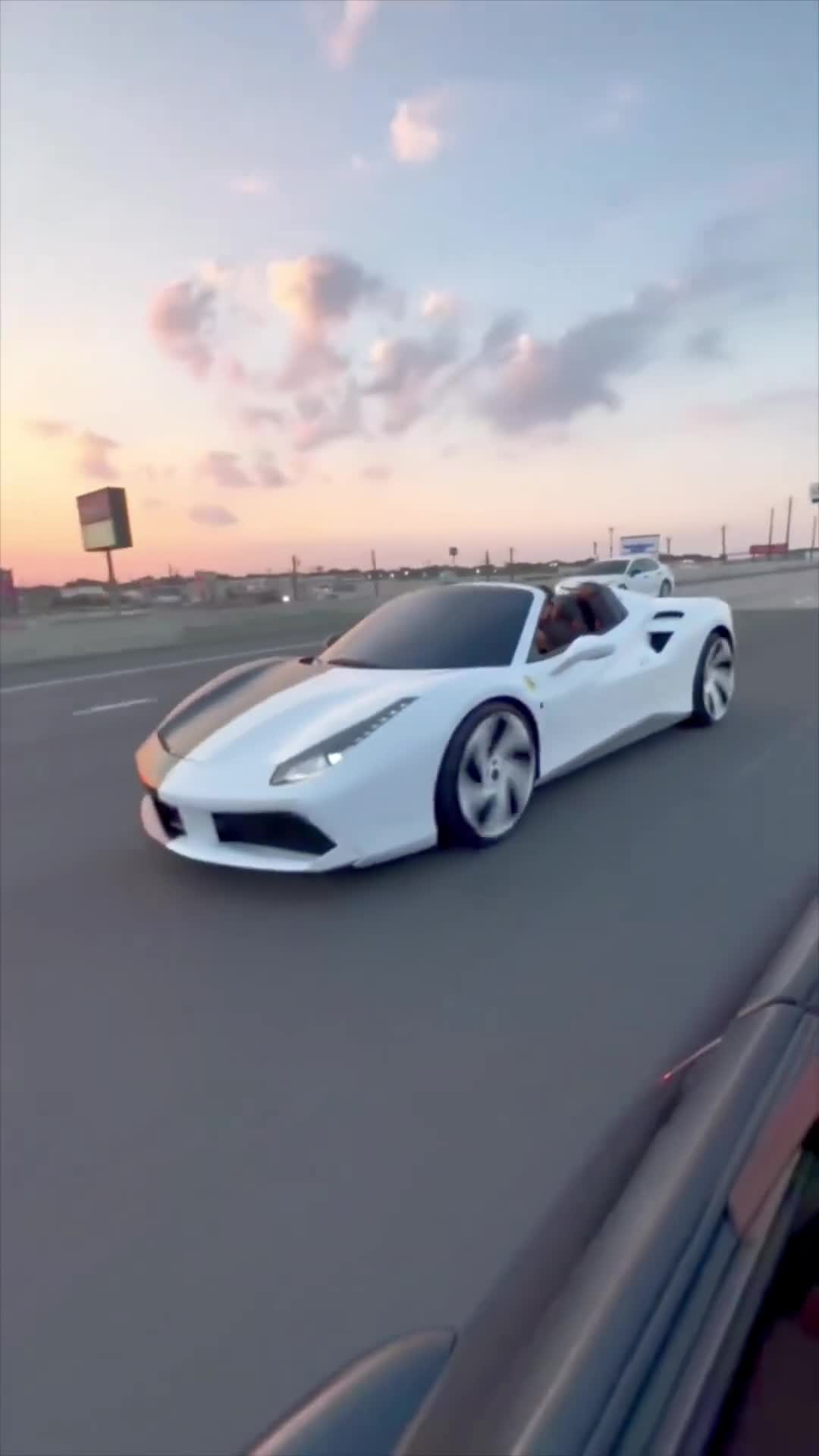 White and black Ferrari riding on 22’s Forgistos 713Ab