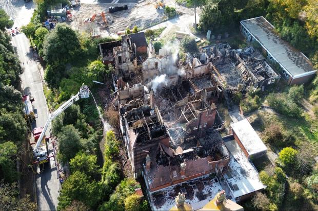 Fire reignites at ravaged former school