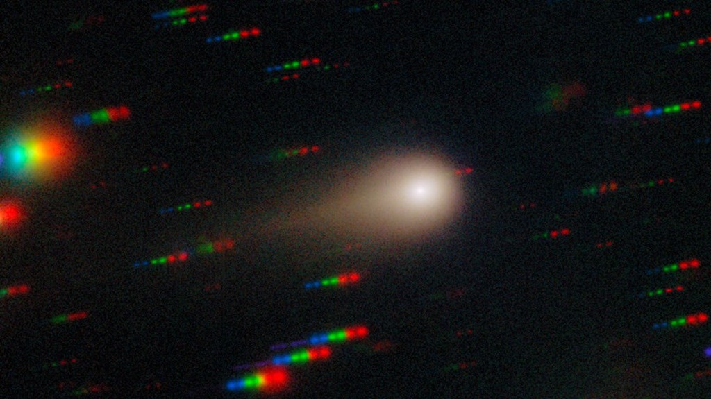 Scientists left baffled after mysterious space object grows a tail ...