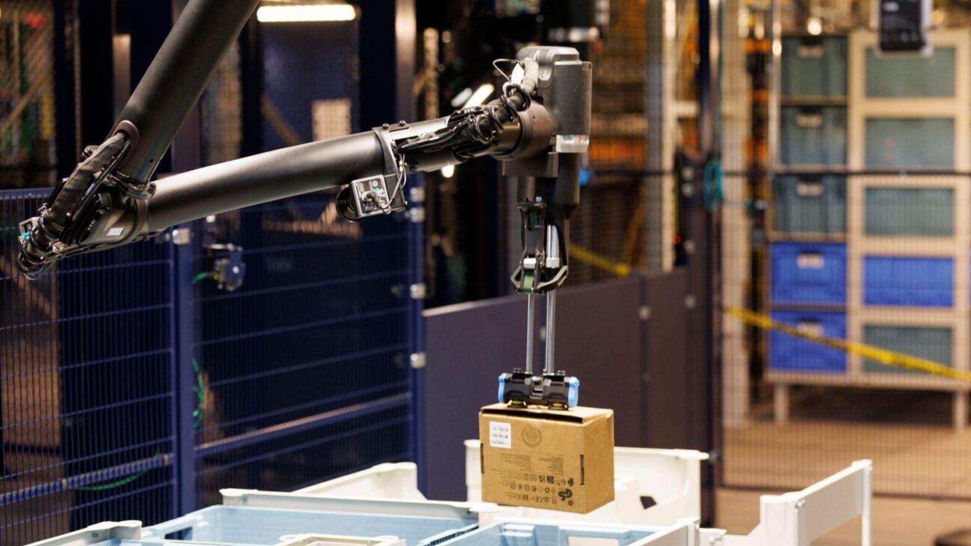 Man vs machine? Amazon debuts new robotic system amid rumors of 600,000 ...