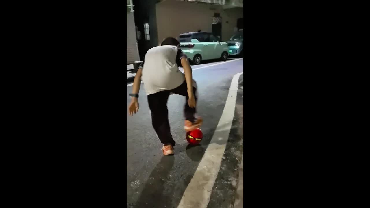 Boy plays with throw disc ball in Guangdong, China
