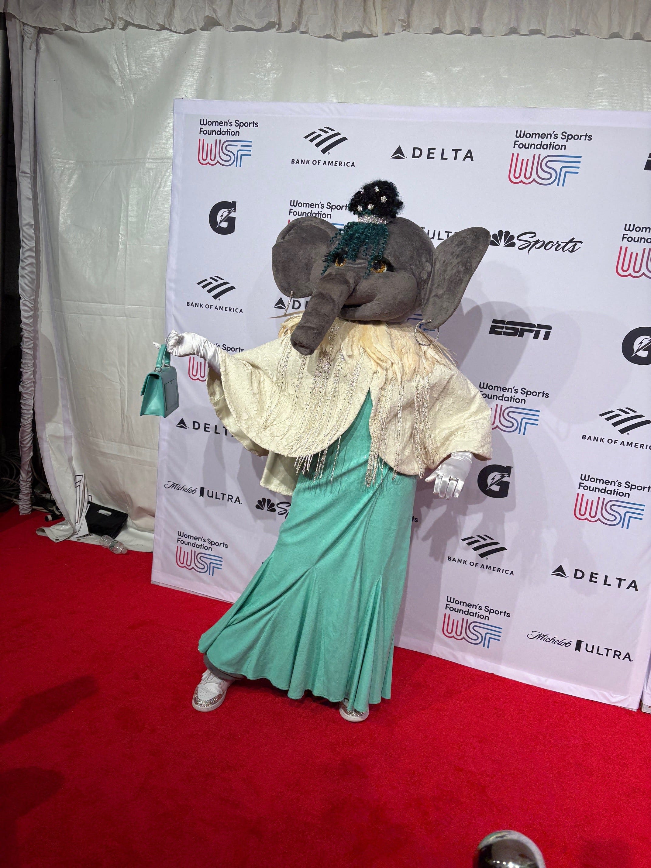 Stars including a bedazzled Ellie the Elephant celebrate women in sports