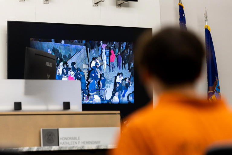 Father of man killed in Kalamazoo tries to jump court barrier at murder ...