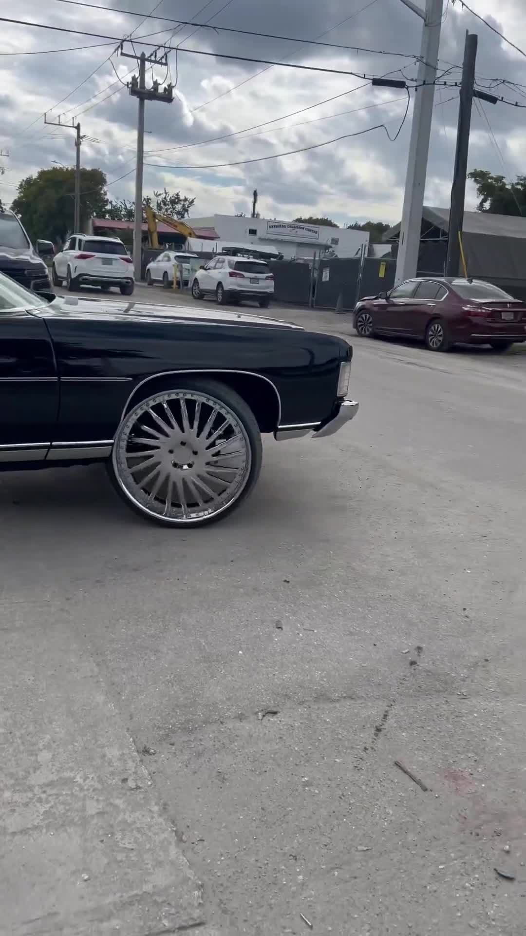 Black 71 Chevy vert on 26’s Taking off