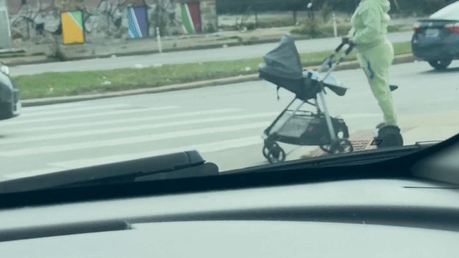 Woman on Hoverboard Pushes Stroller in 'Jetsons' Moment