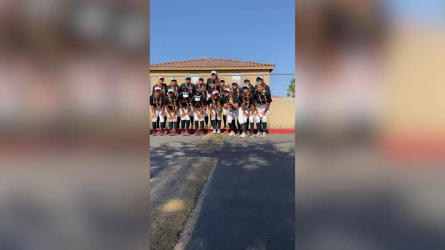 Team receives unexpected pregnancy announcement from their softball coach