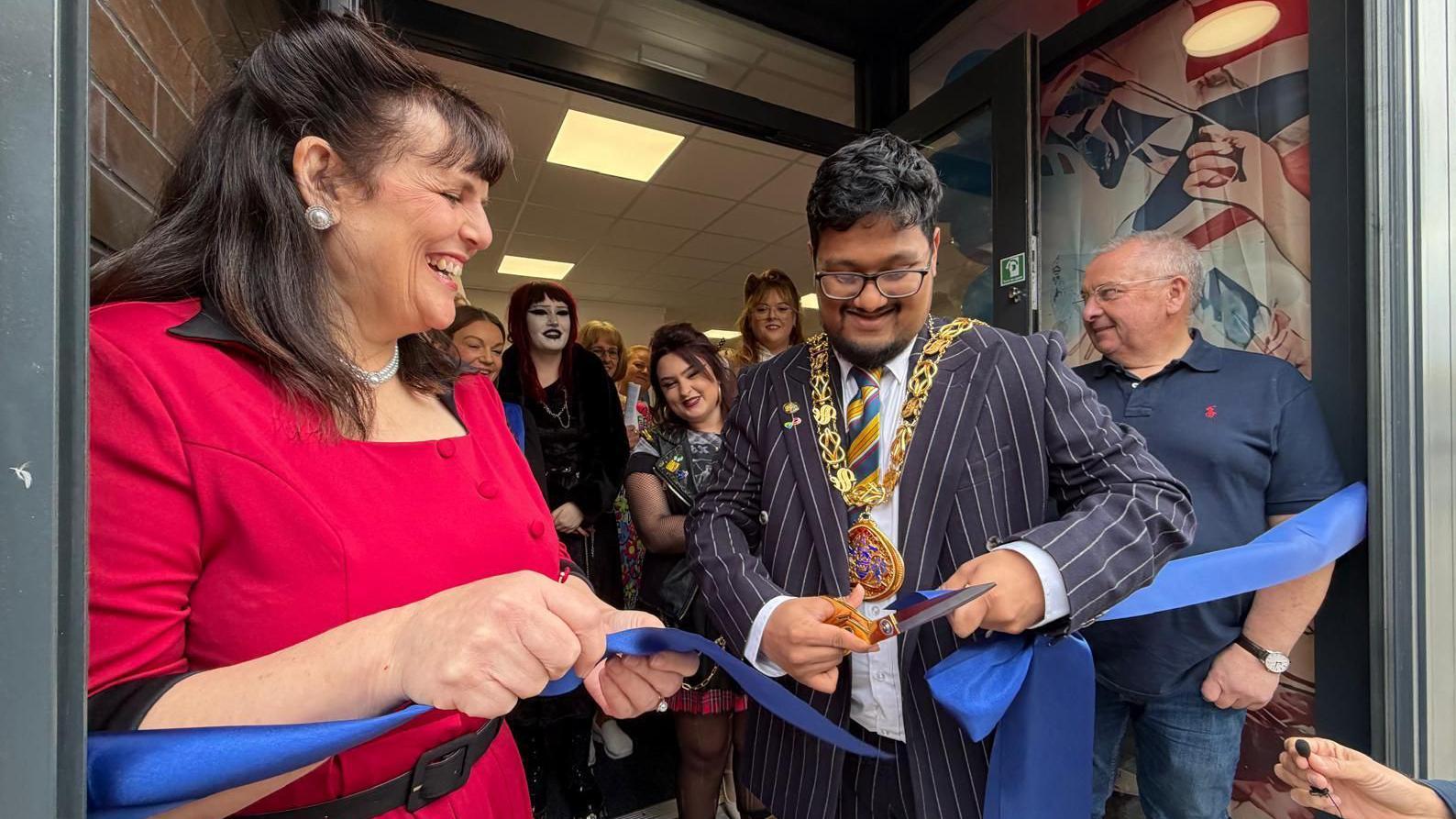 City 'healing' as torched advice centre reopens