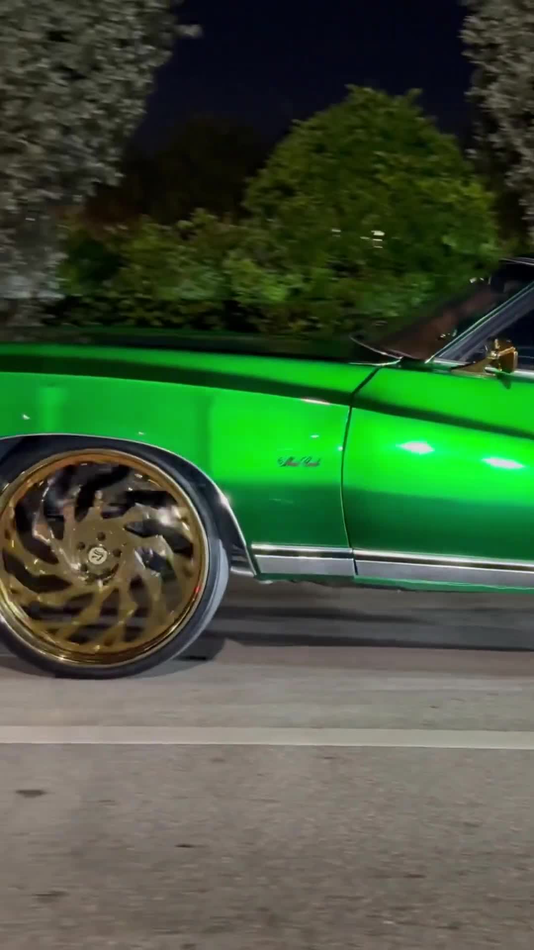 Candy green Chevy Monte Carlo on gold 28’s skatin