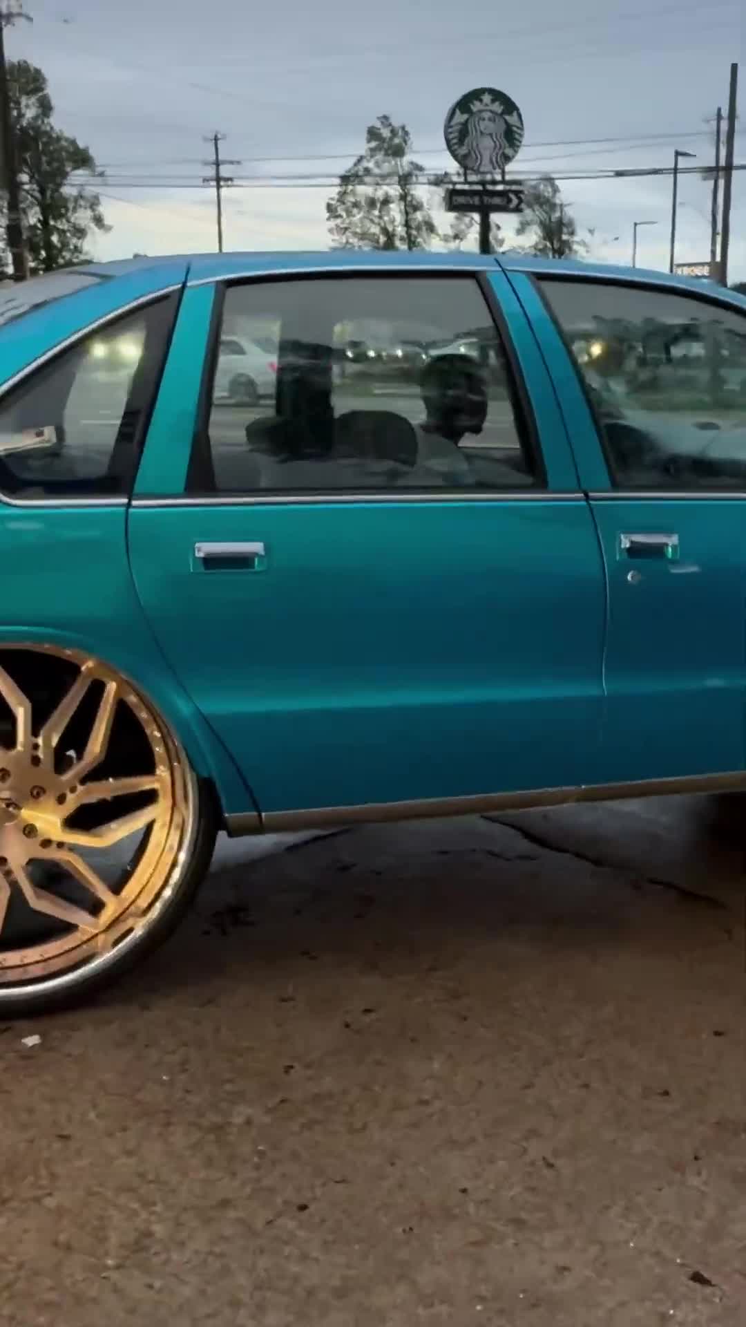 Candy Teal Chevy on 26’s Pullin up to the Gas Station