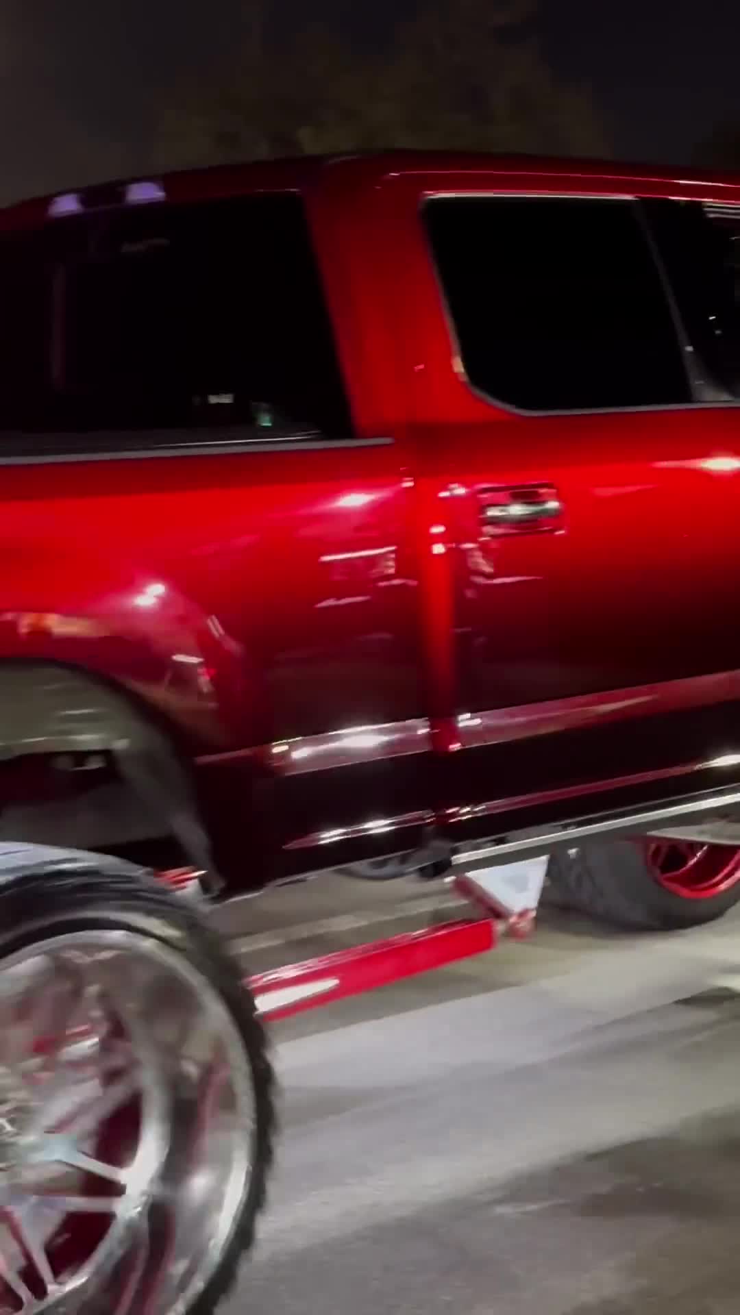 Candy red Ford truck on off-road 28’s