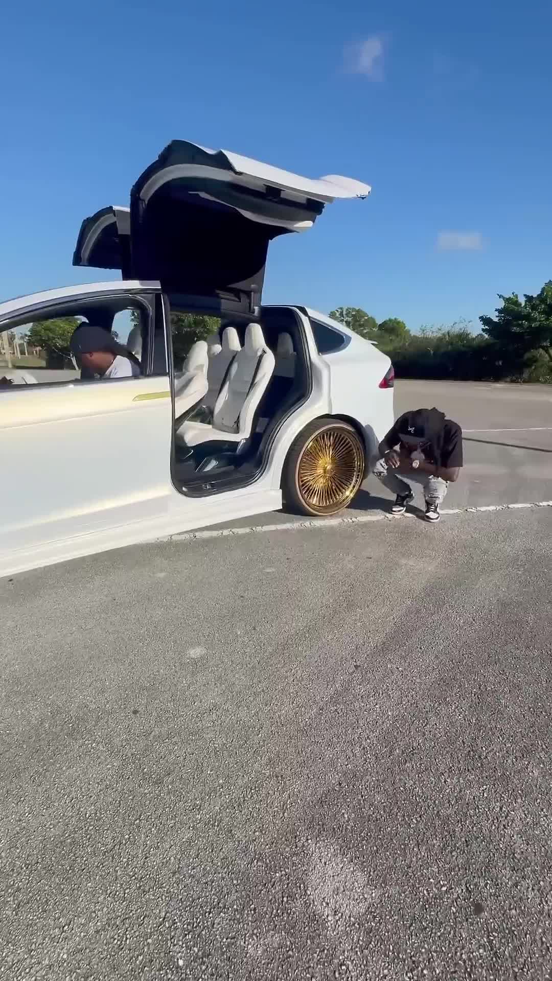 Model X Tesla on gold 24’s Daytons