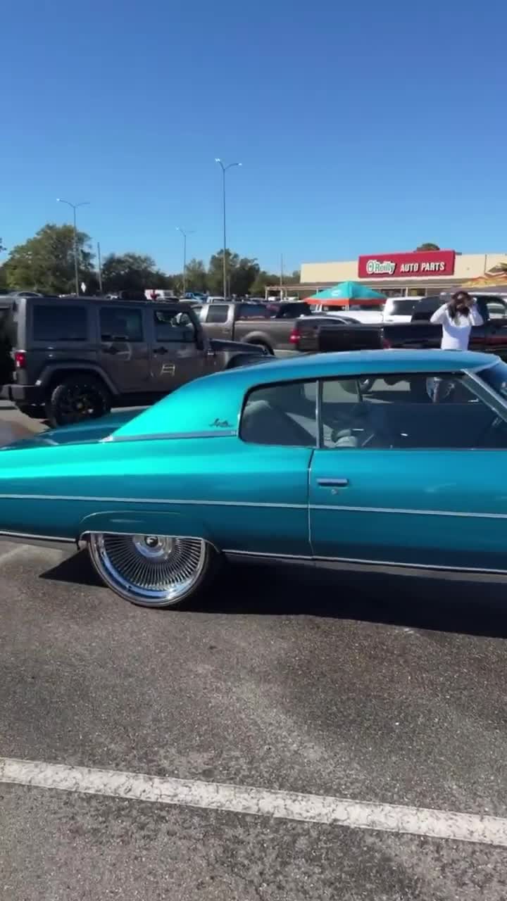 Candy teal Chevy donk on 26’s Forgiatos